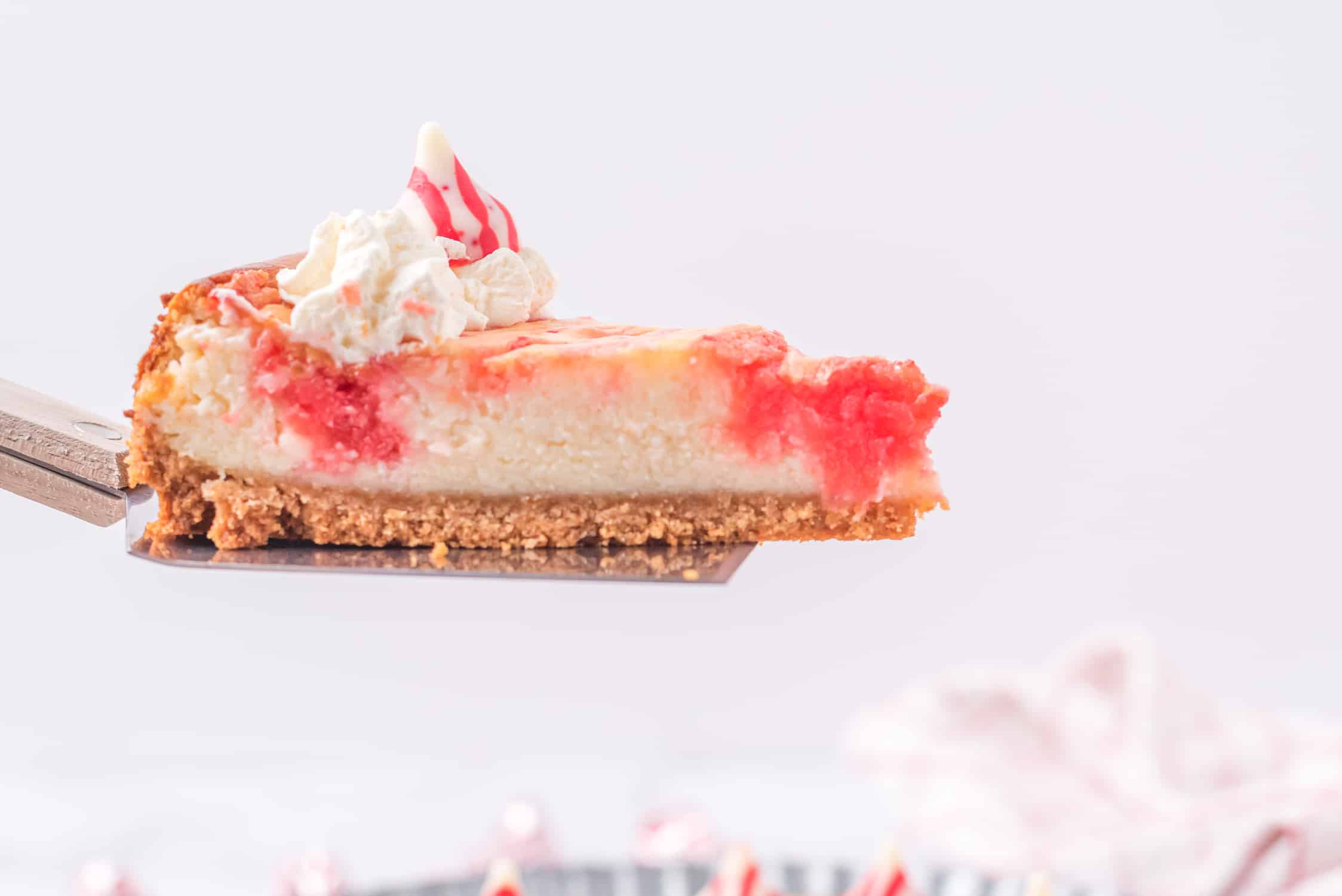 The Best Peppermint Candy Cane Kisses Cheesecake